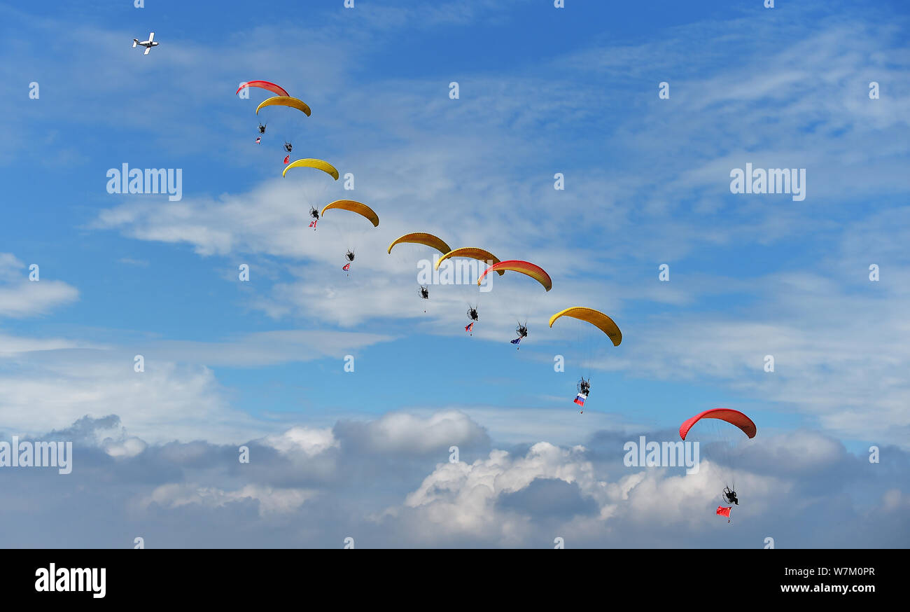 Members from different countries perform skydiving during the 6th ...