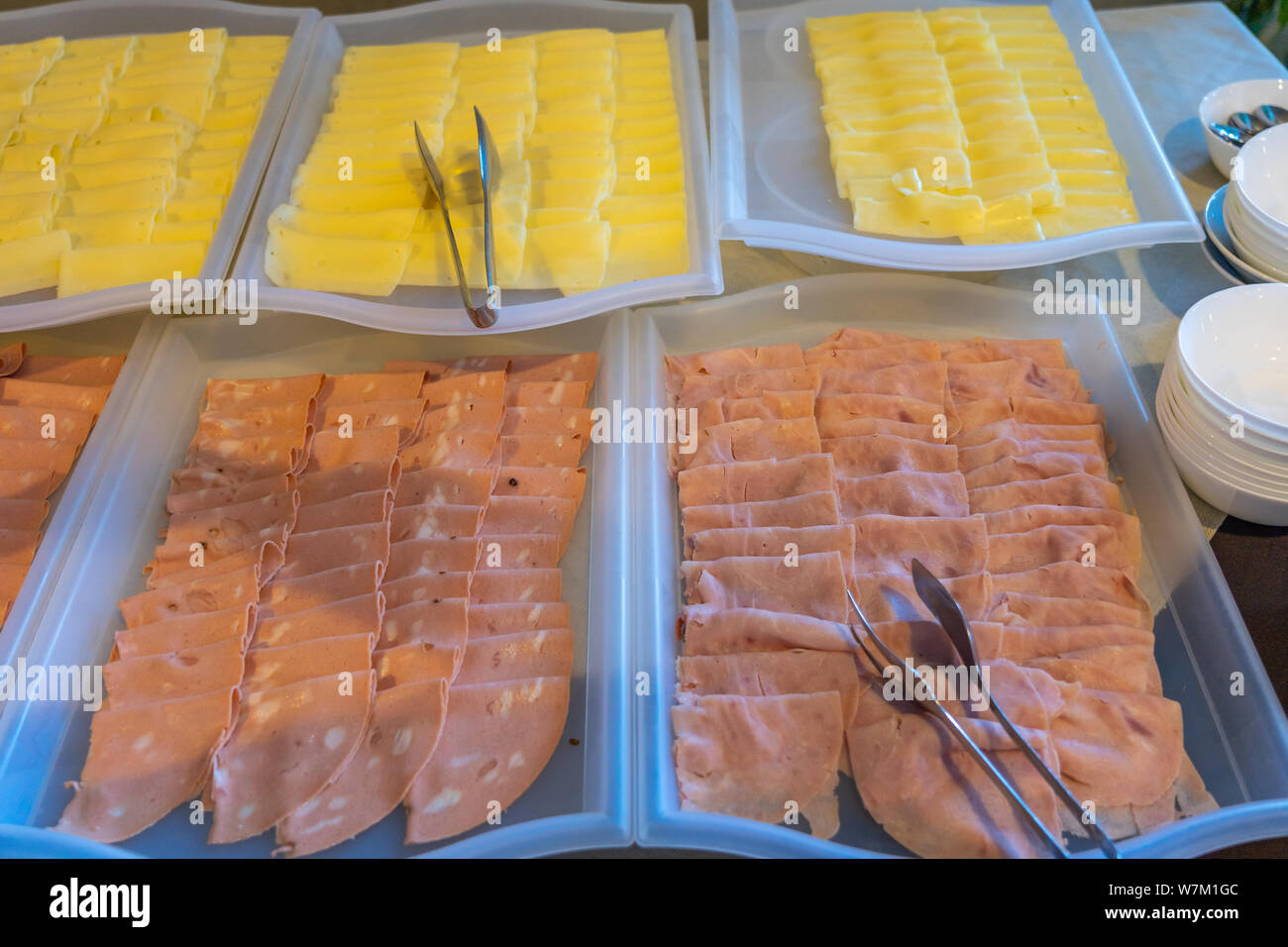 Trays of bacon and cheese slices in buffet restaurant Stock Photo - Alamy