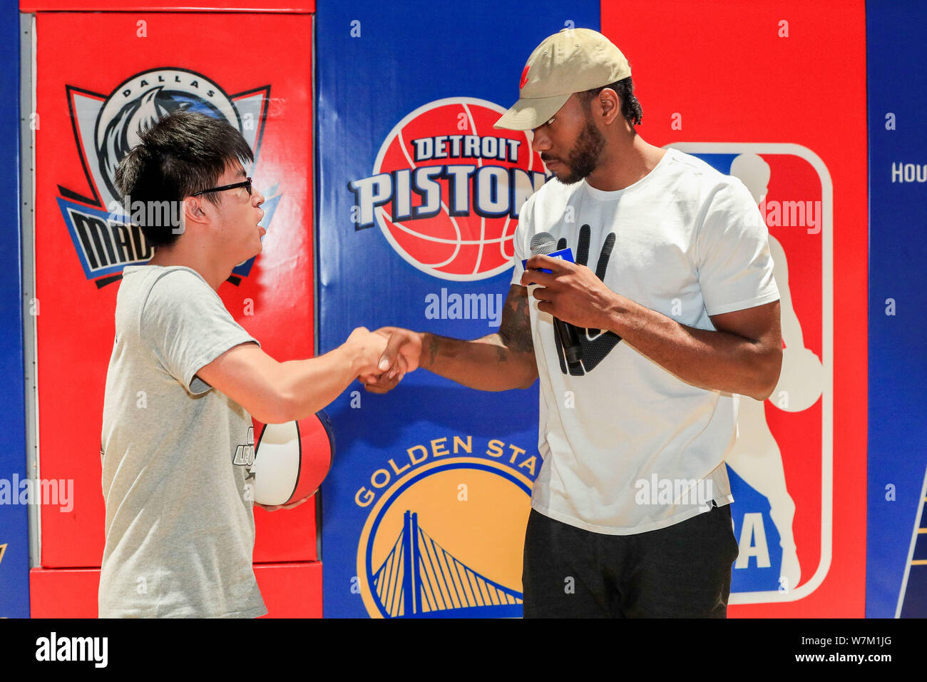 NBA star Kawhi Leonard of San Antonio Spurs, right, attends a fan ...