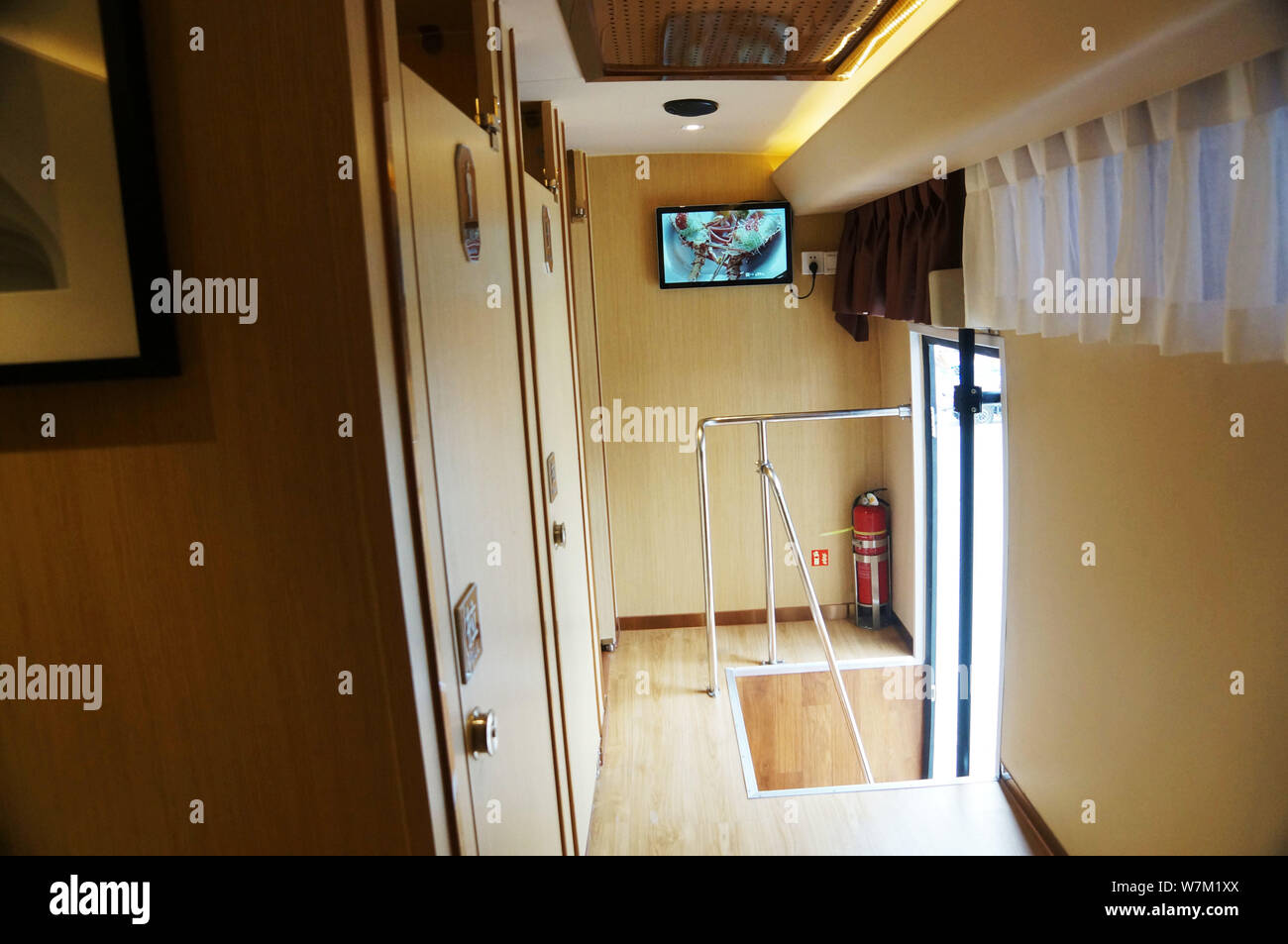 Inside view of a bus made into mobile washrooms at Five Great Avenues ...