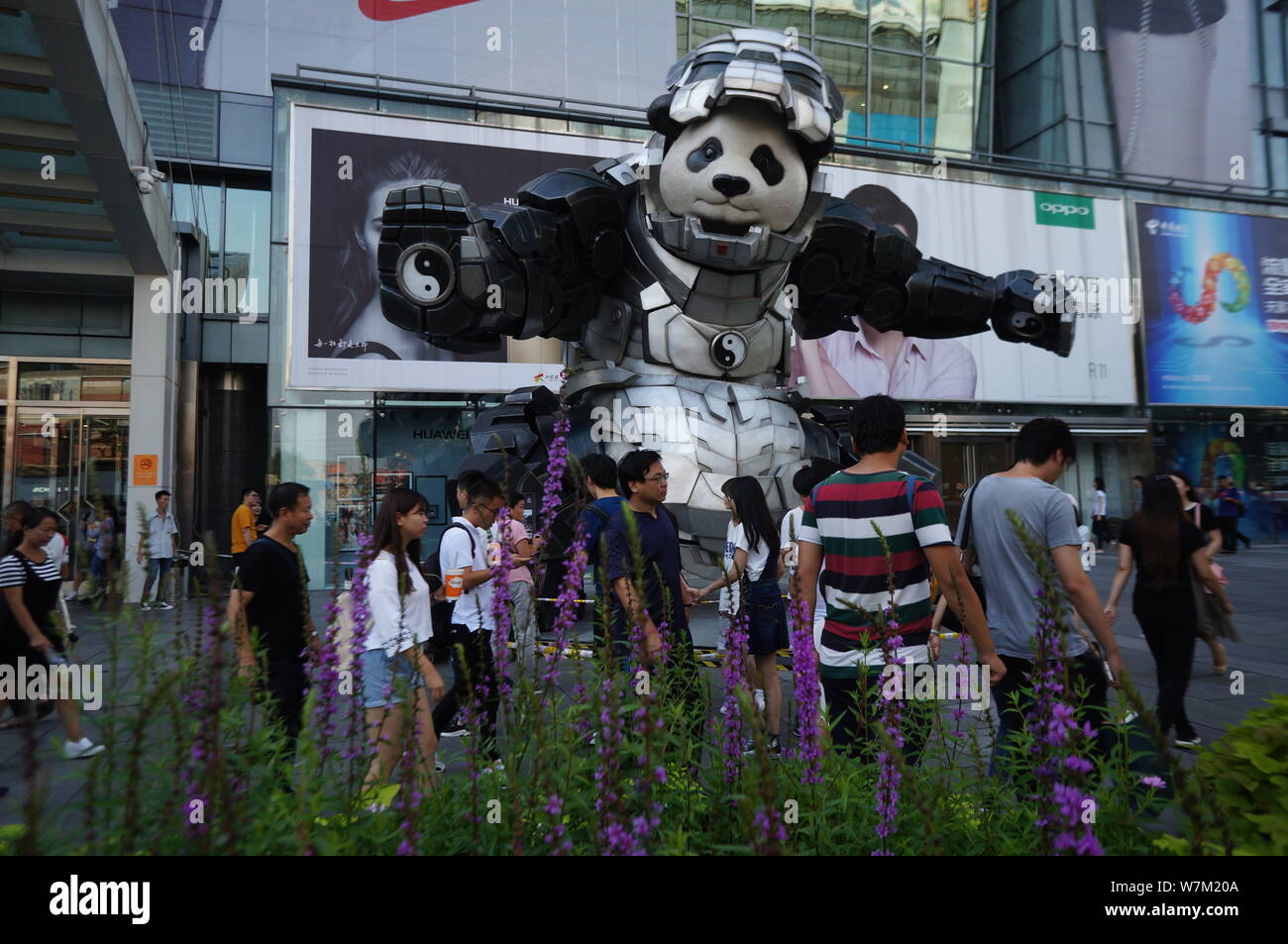 A Tai Chi panda sculpture is on display in front of a Joy City Shopping ...