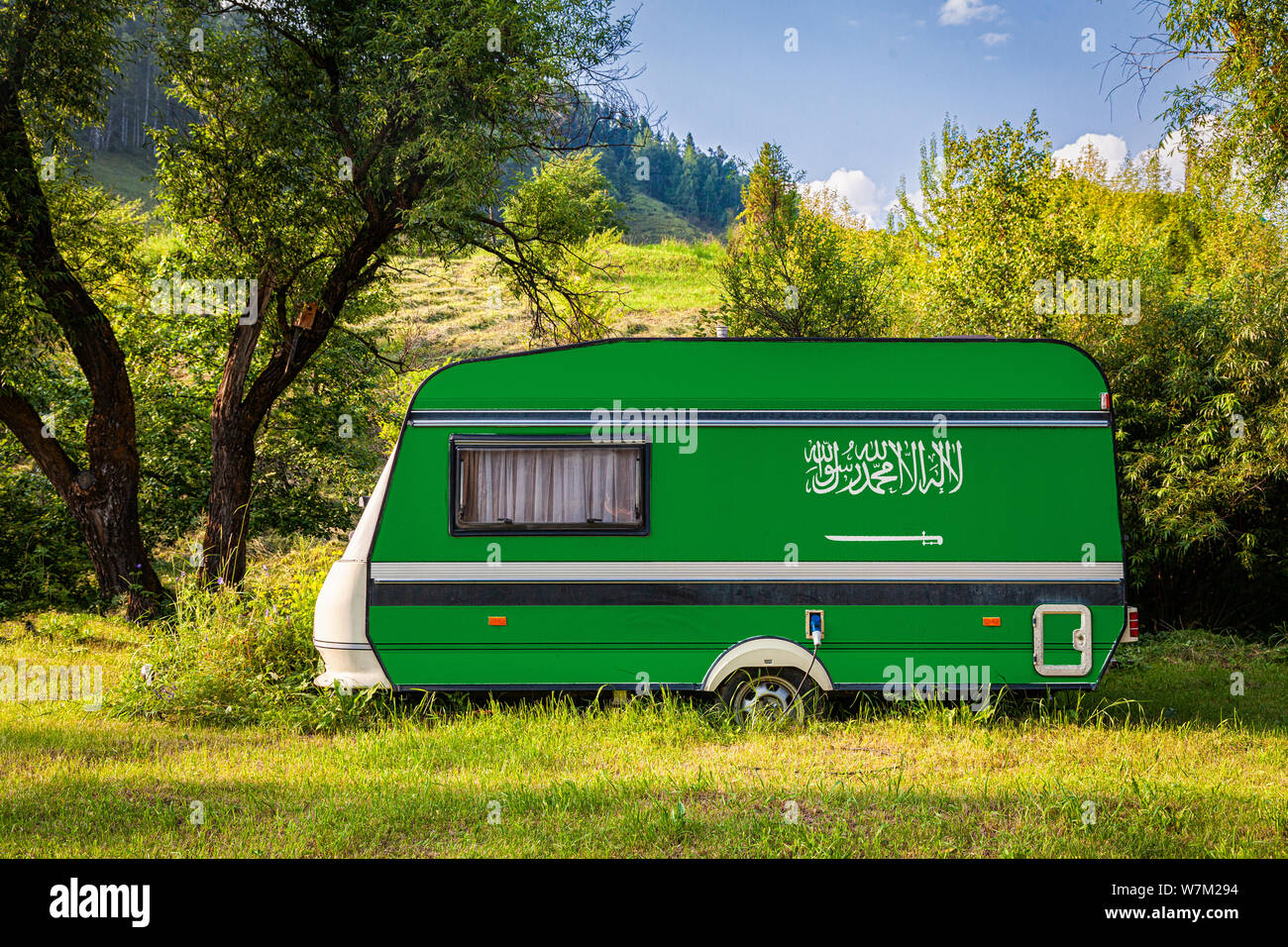 A car trailer, a motor home, painted in the national flag of Saudi ...