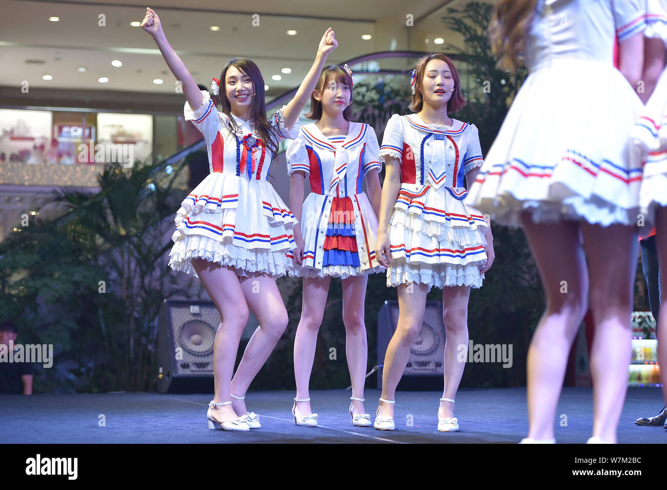 Members of Chinese idol girl group SHY48 attend a promotional event at ...