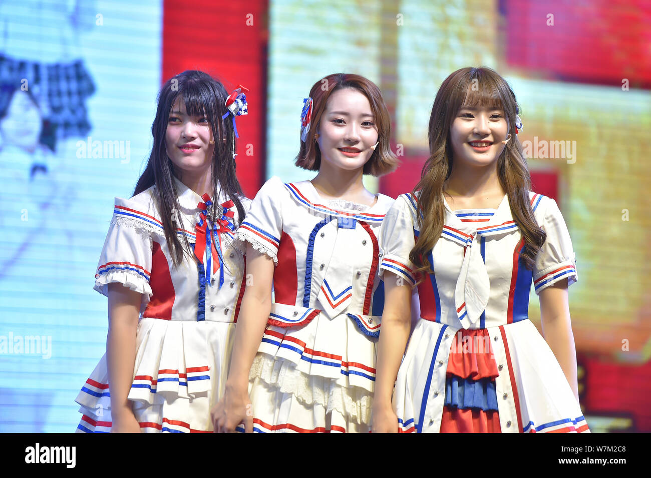 Members of Chinese idol girl group SHY48 attend a promotional event at ...