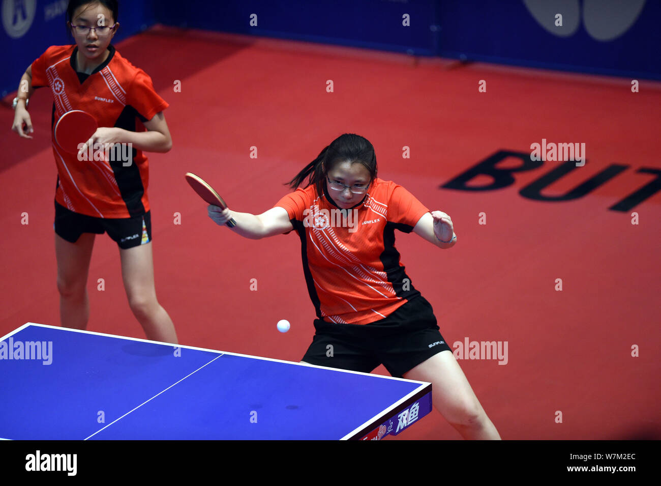 Lee Ka Yee, right, of Hong Kong, returns a shot as she and Ng Wing Lam ...