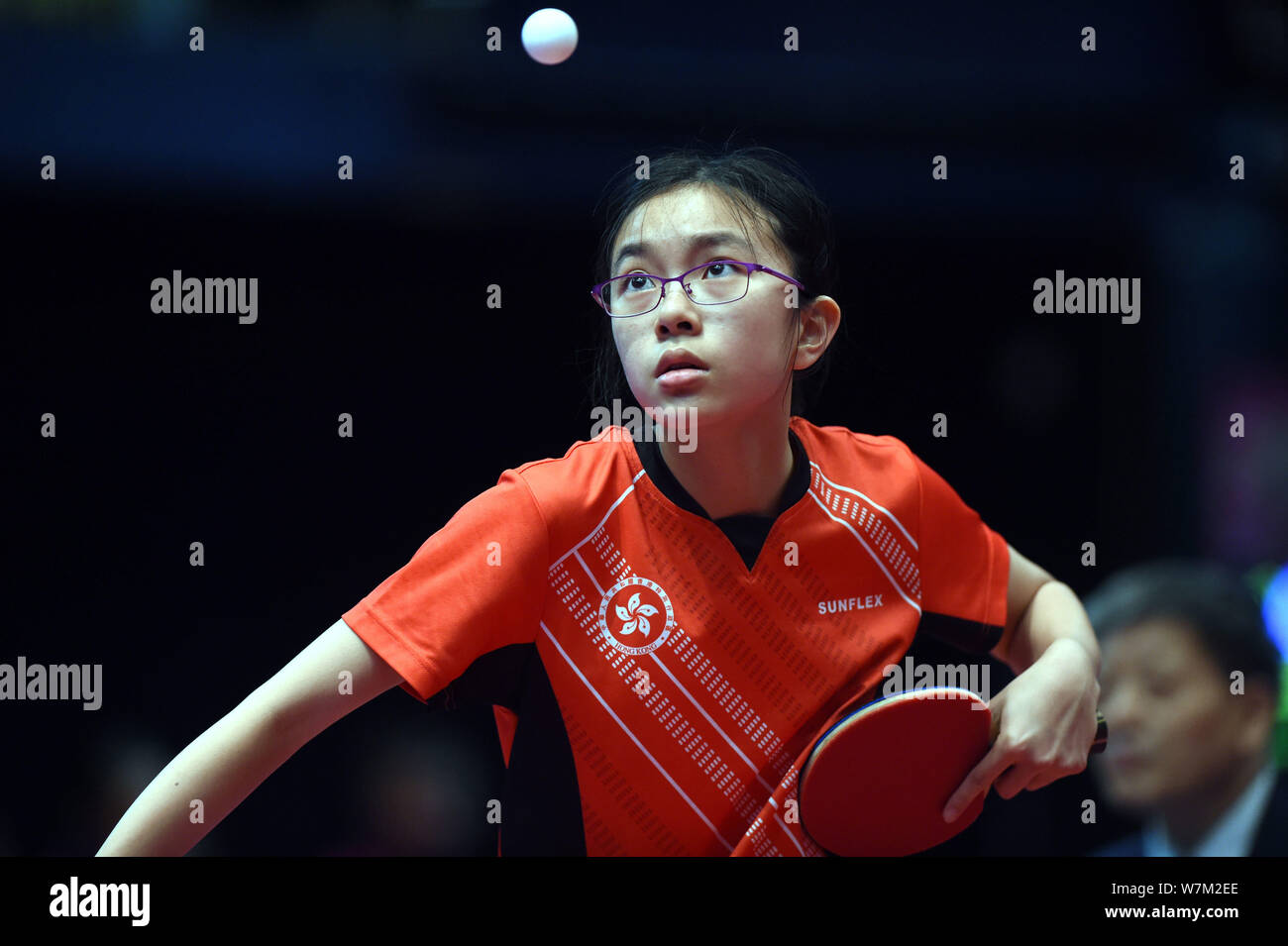 Ng Wing Lam of Hong Kong serves as she and Lee Ka Yee compete against ...