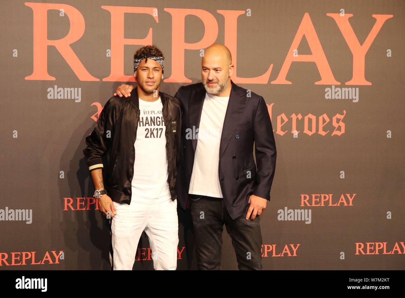 Brazilian football star Neymar, left, or Neymar Jr., poses as he ...
