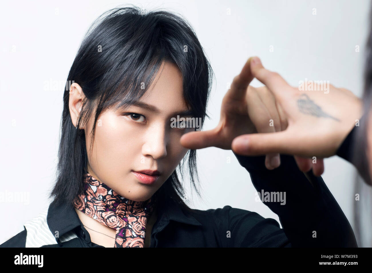 Chinese singer Zhou Bichang poses for portrait photos during an ...