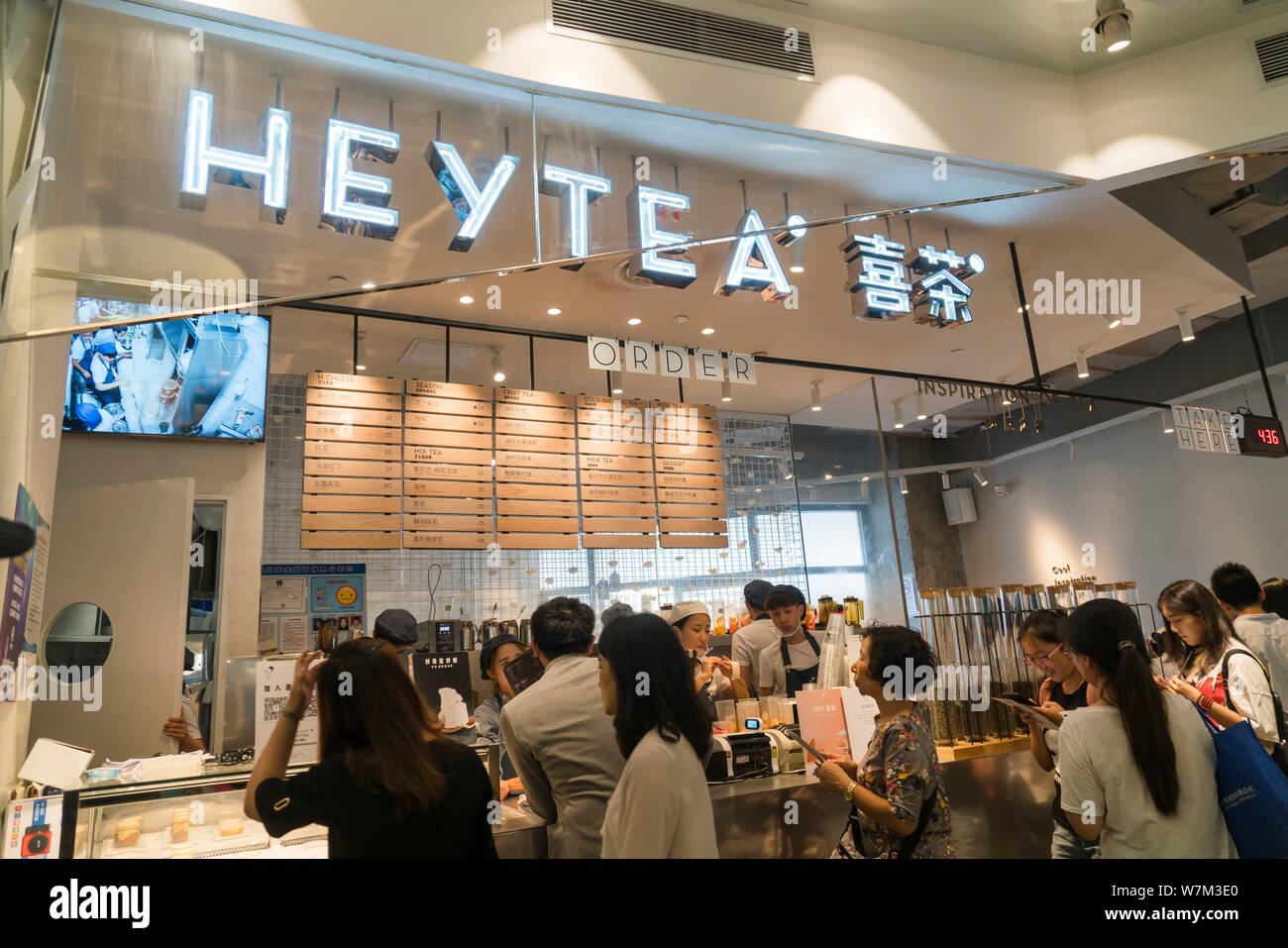 Chinese customers queue up to buy cheese tea at a branch of HEYTEA, a ...