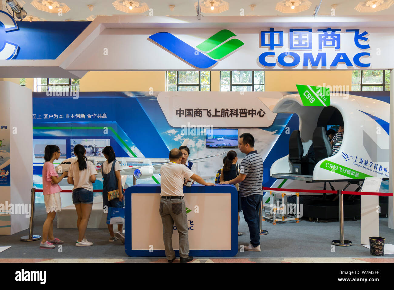 Visitors queue up to try out a flight simulator of China's first large ...
