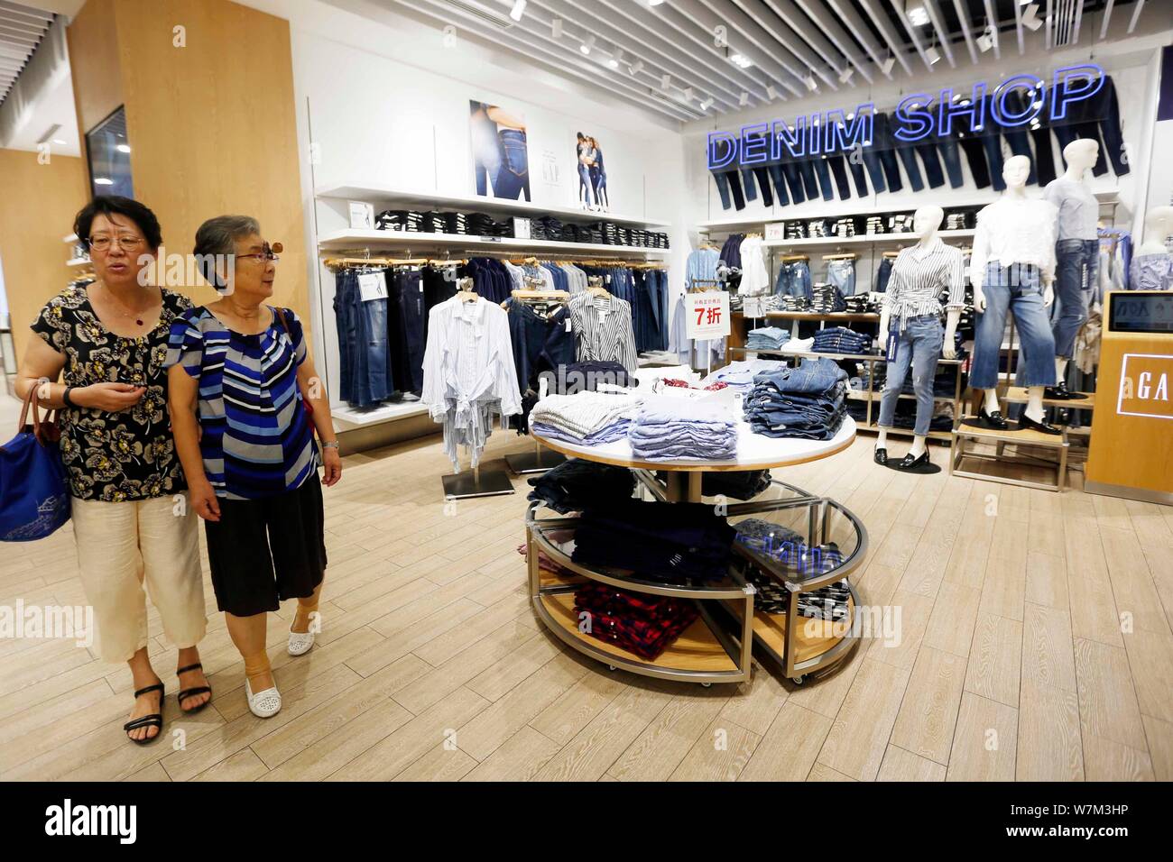 Customers shop at the China's largest Gap flagship store on the West ...