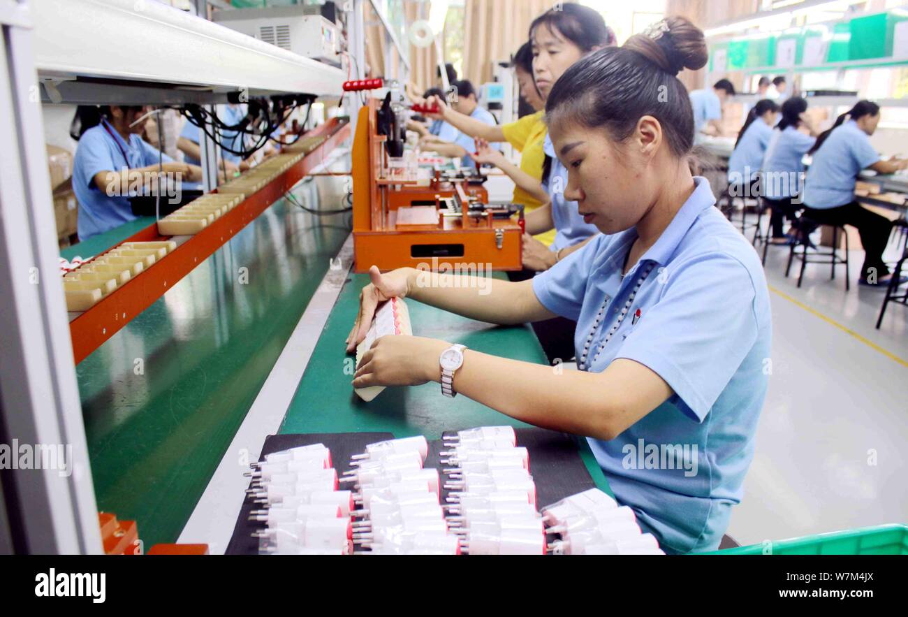 Female workers in manufacturing line hi-res stock photography and ...