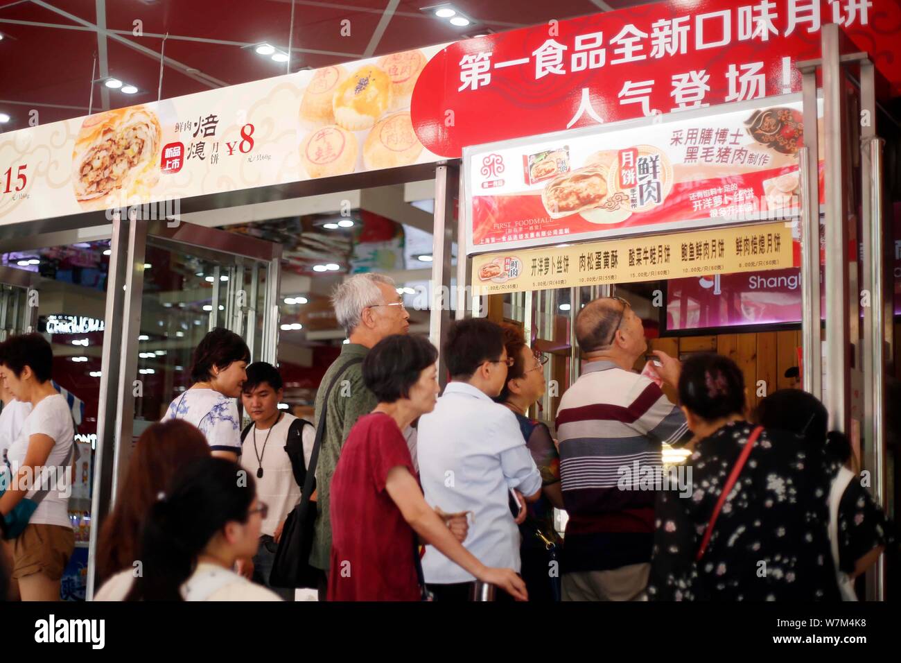 Chinese customers queue up to buy mooncakes stuffed with shrimp and ...