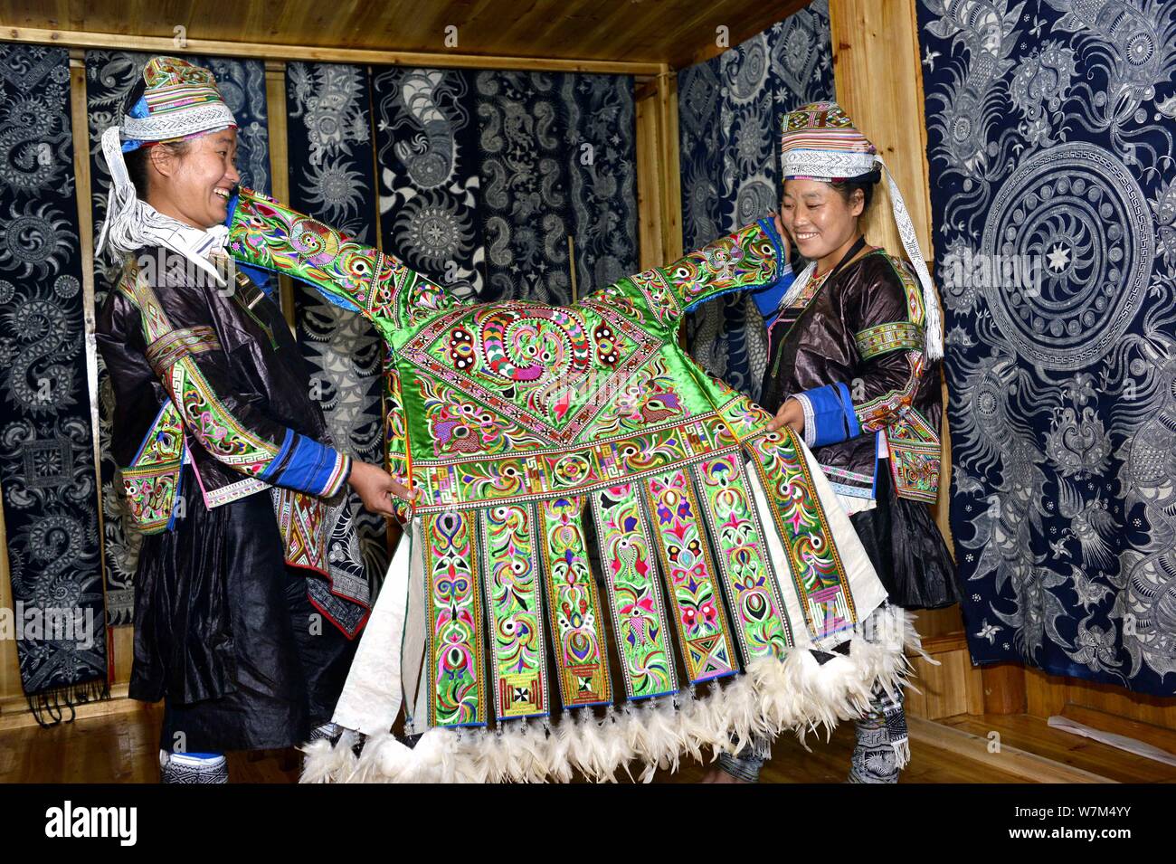Chinese women of Miao ethnic group wearing traditional costumes show a ...