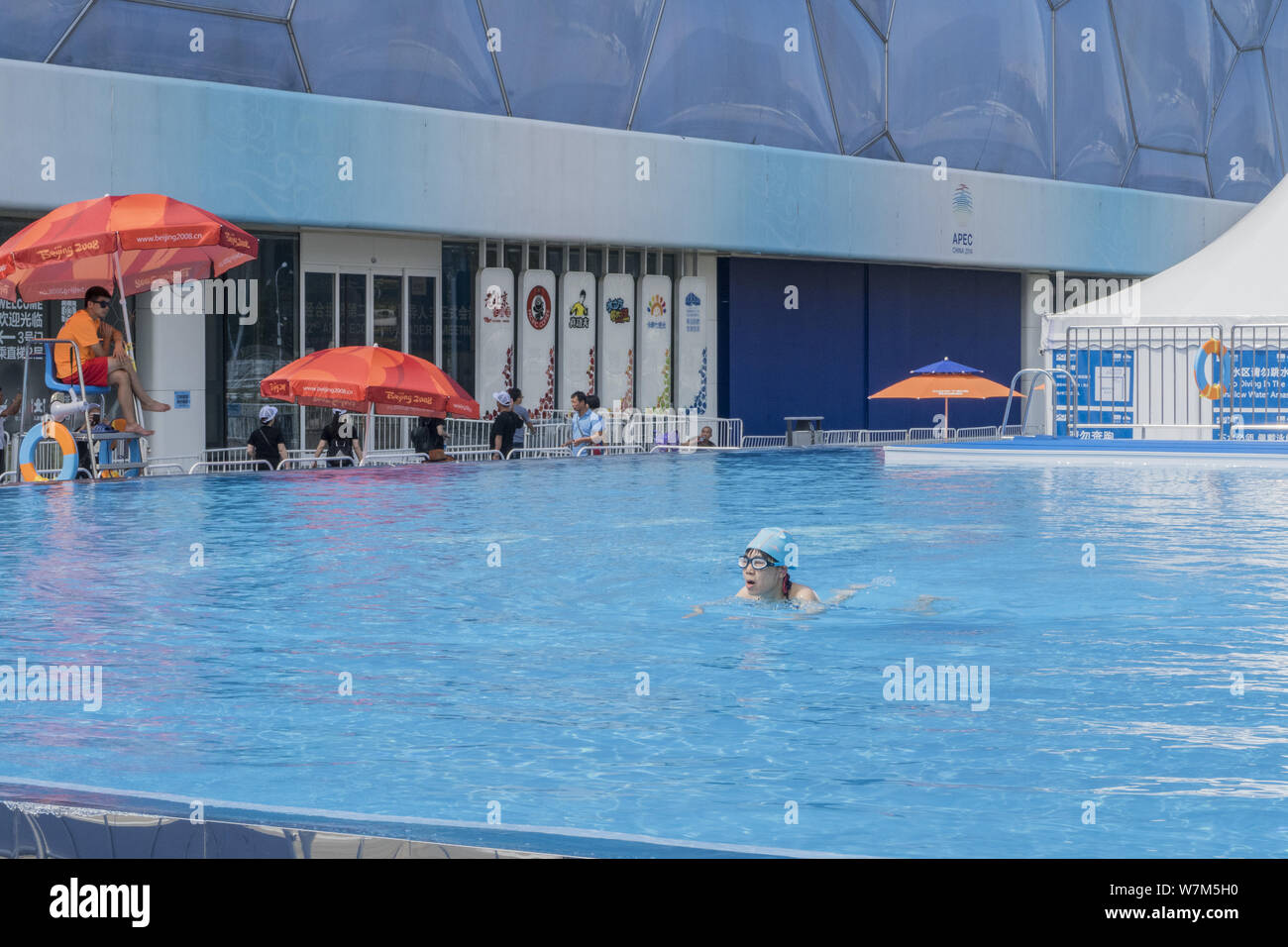 Local residents go swimming in the 25 meter-long and 15 meter-wide ...