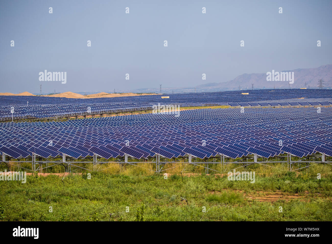 Solar panels are installed at a photovoltaic (PV) power plant of Elion ...