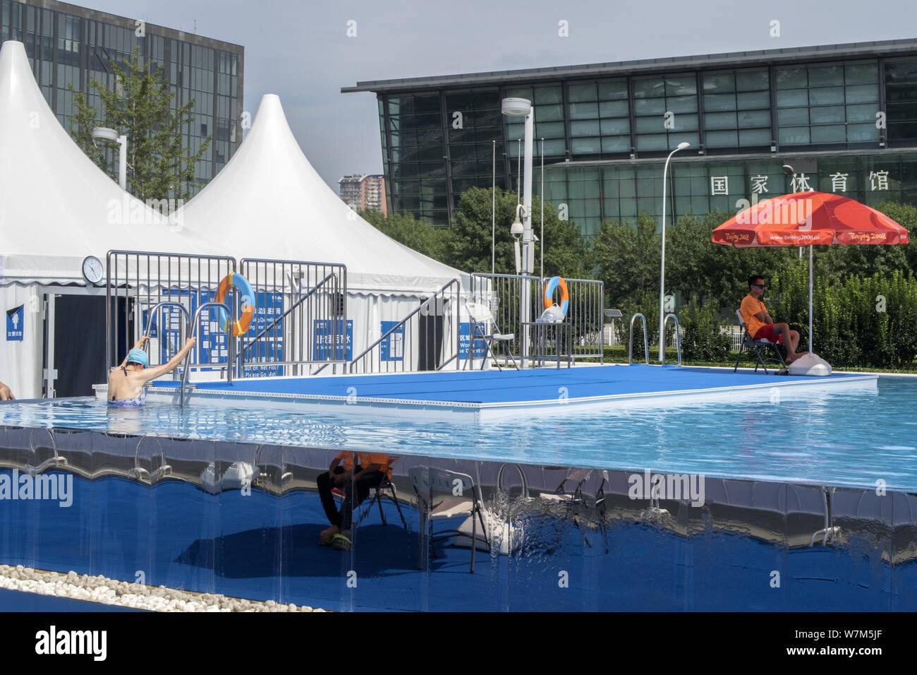 Local residents go swimming in the 25 meter-long and 15 meter-wide ...