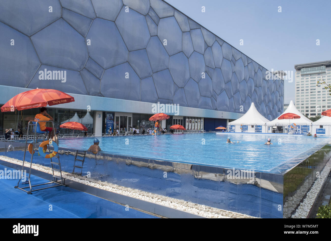 Local residents go swimming in the 25 meter-long and 15 meter-wide ...