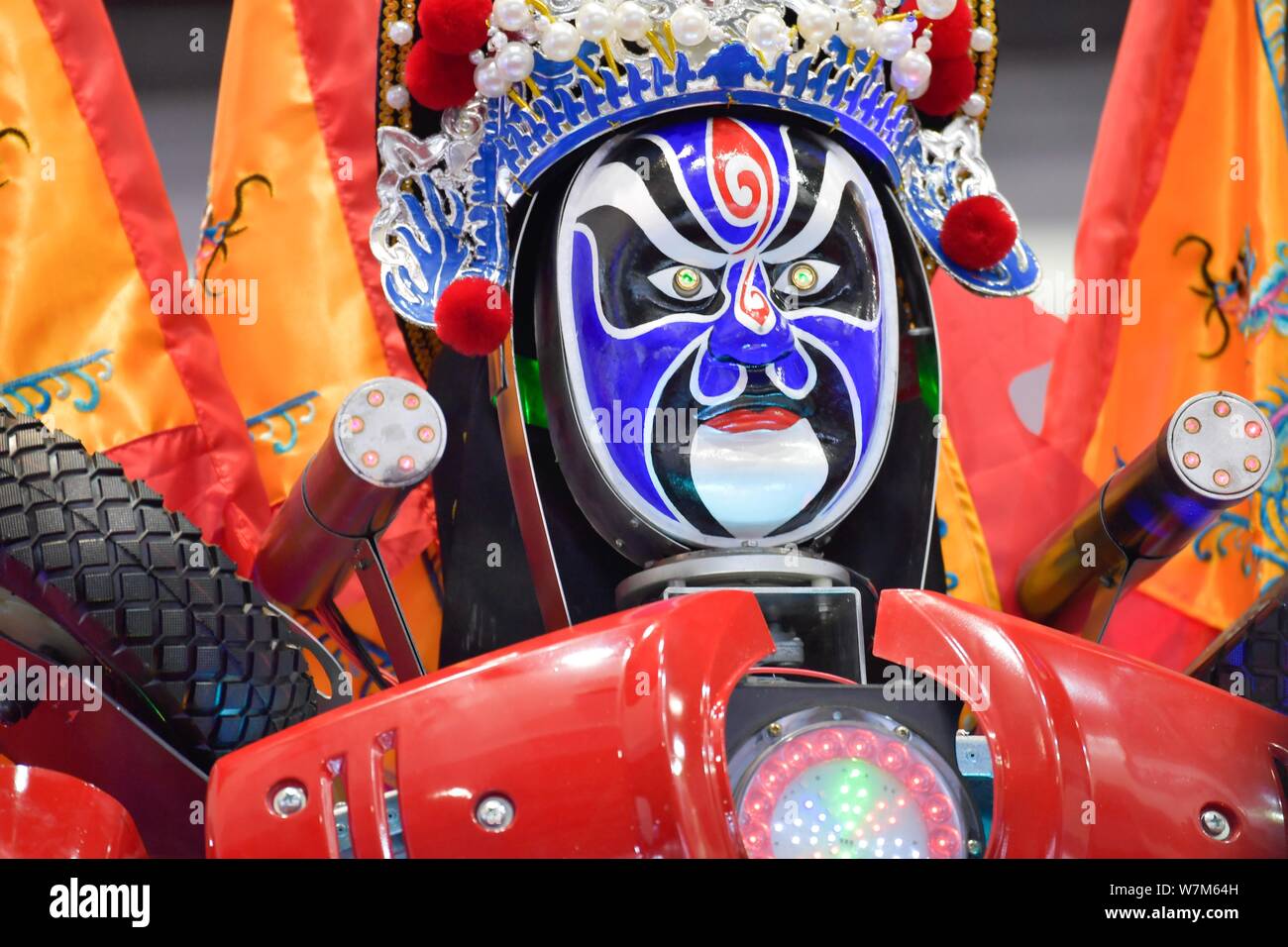 A transformer robot that can change its face mask is on display during ...