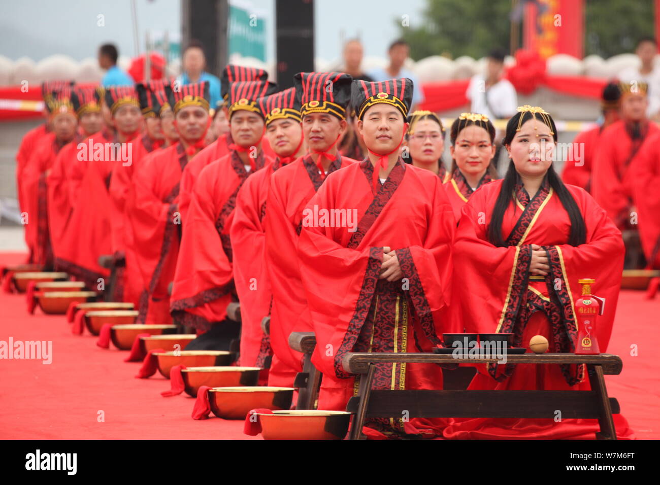 Couples of newlyweds dressed in traditional Han costumes take part in a ...