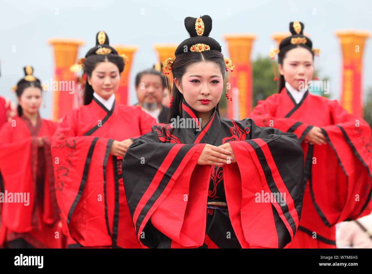 Brides dressed in traditional Han costumes are pictured during a Han ...