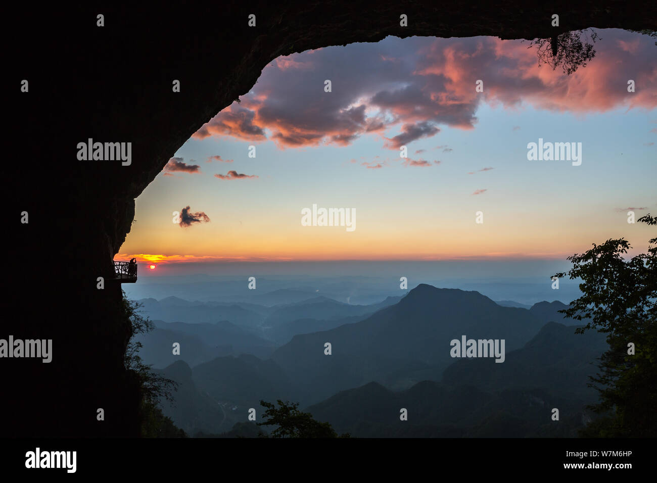 Landscape of sunset glow on a plank road built along the vertical cliff ...