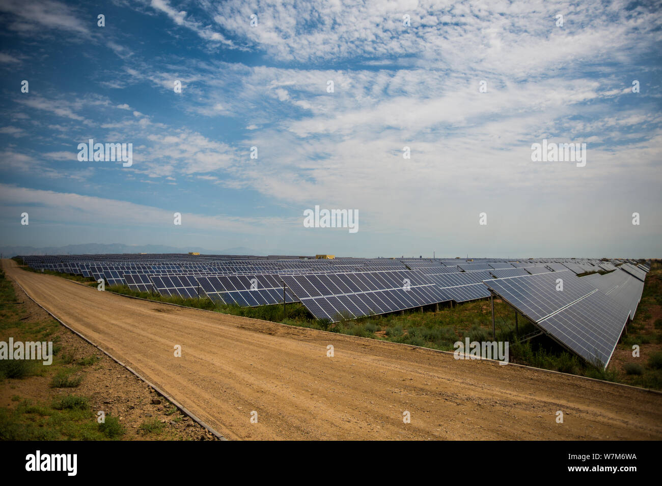 Solar panels are installed at a photovoltaic (PV) power plant of Elion ...