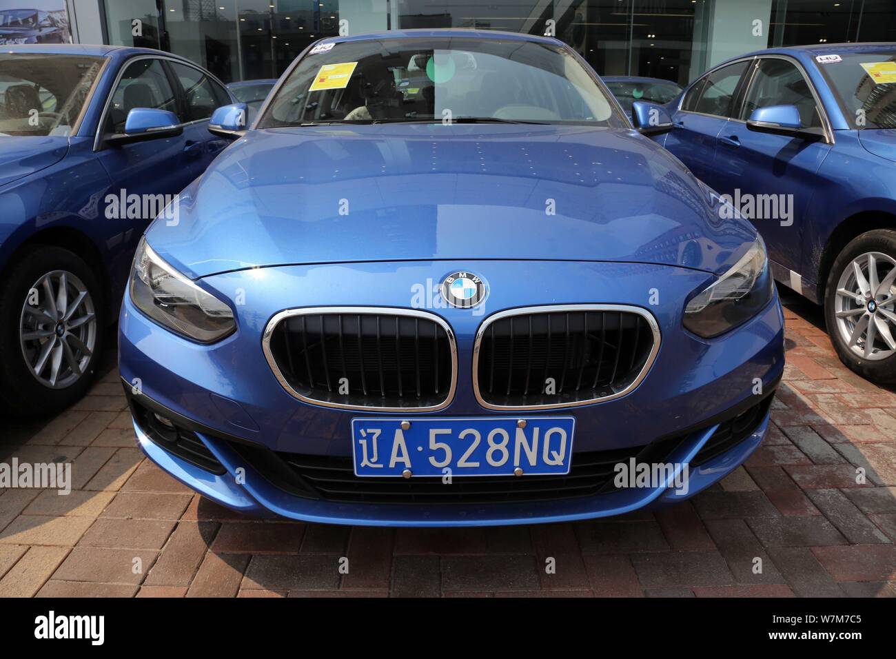 BMW 1-Series vehicles of car-sharing service "Hong Yang" (HY) are lined ...