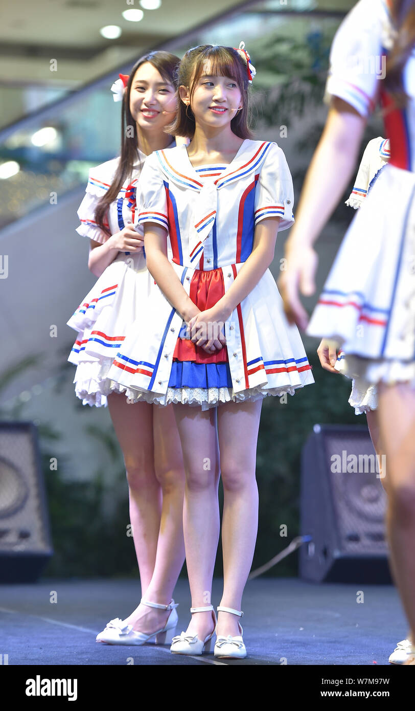 Members of Chinese idol girl group SHY48 attend a promotional event at ...