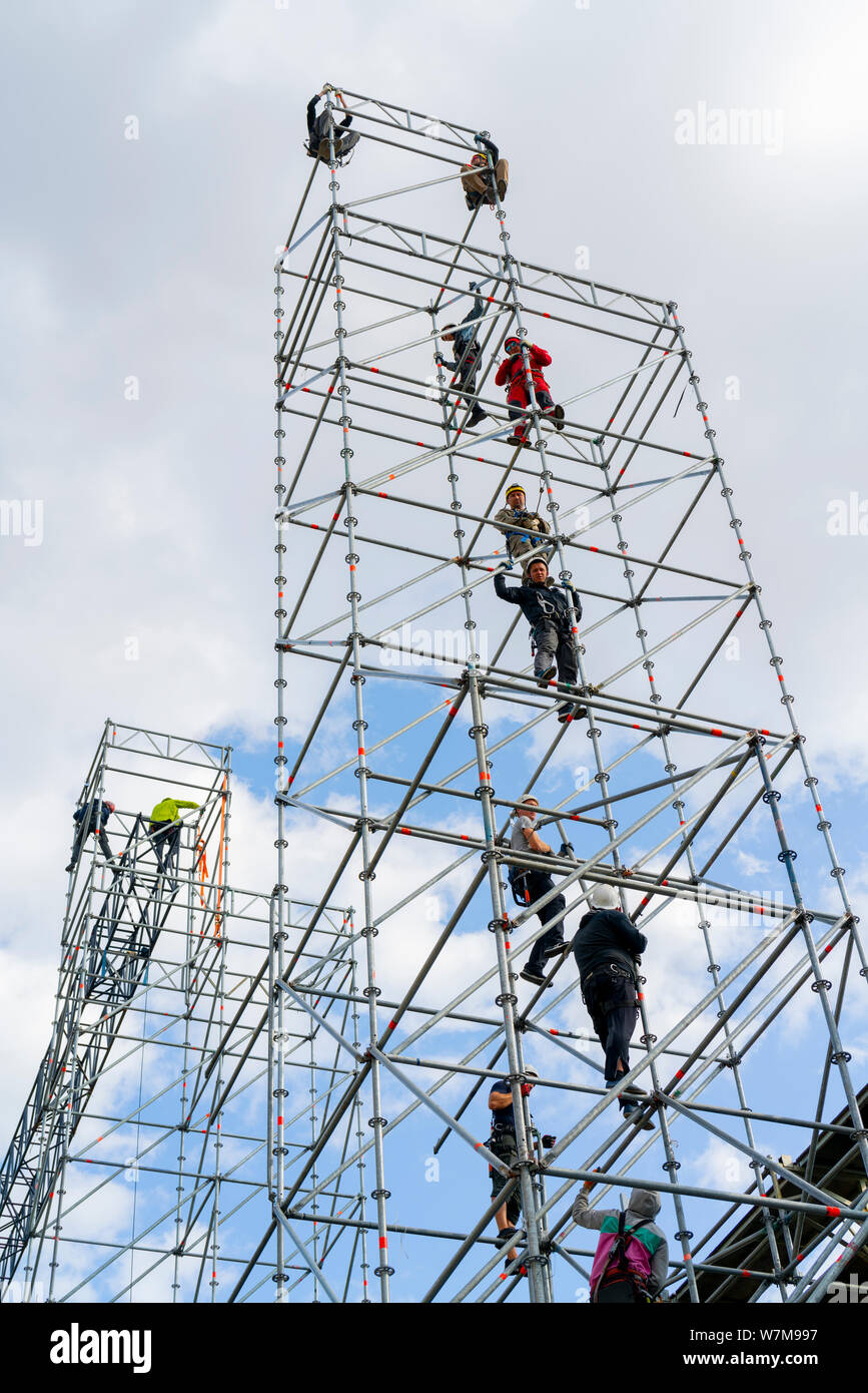 Moscow, Russia, August 6, 2019. Builders assemblers assemble a high ...