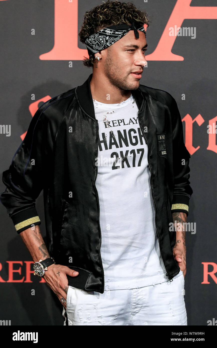 Brazilian football star Neymar, or Neymar Jr., poses as he arrives at ...