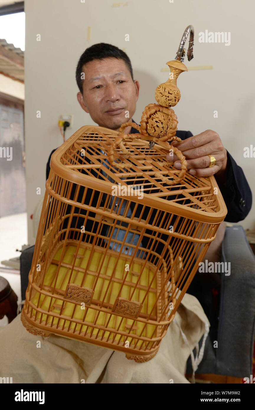 Chinese birdcage making master Yangchun makes the artwork of a birdcage ...