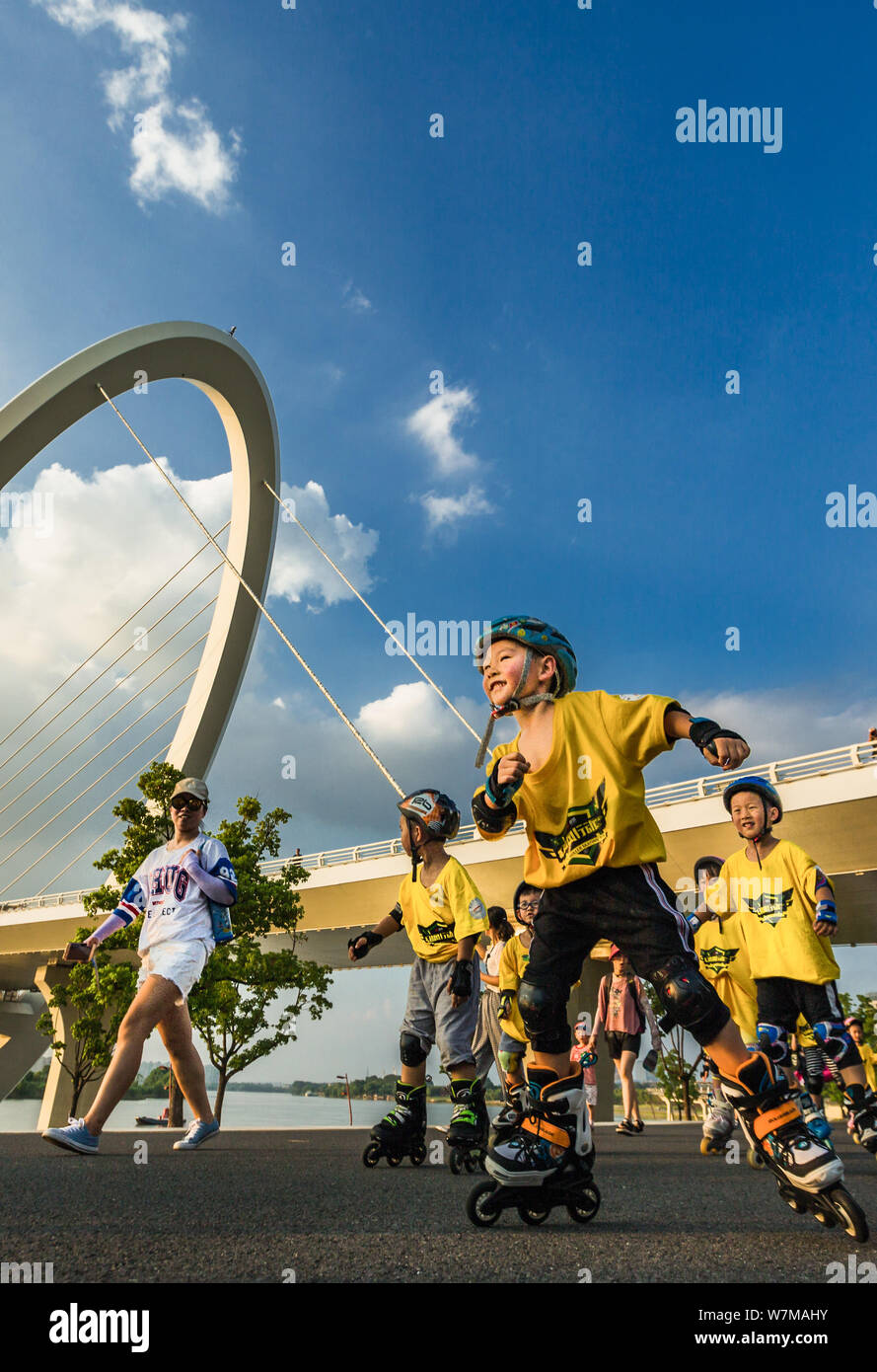 Chinese enthusiasts take part in a roller sports event to celebrate the ...