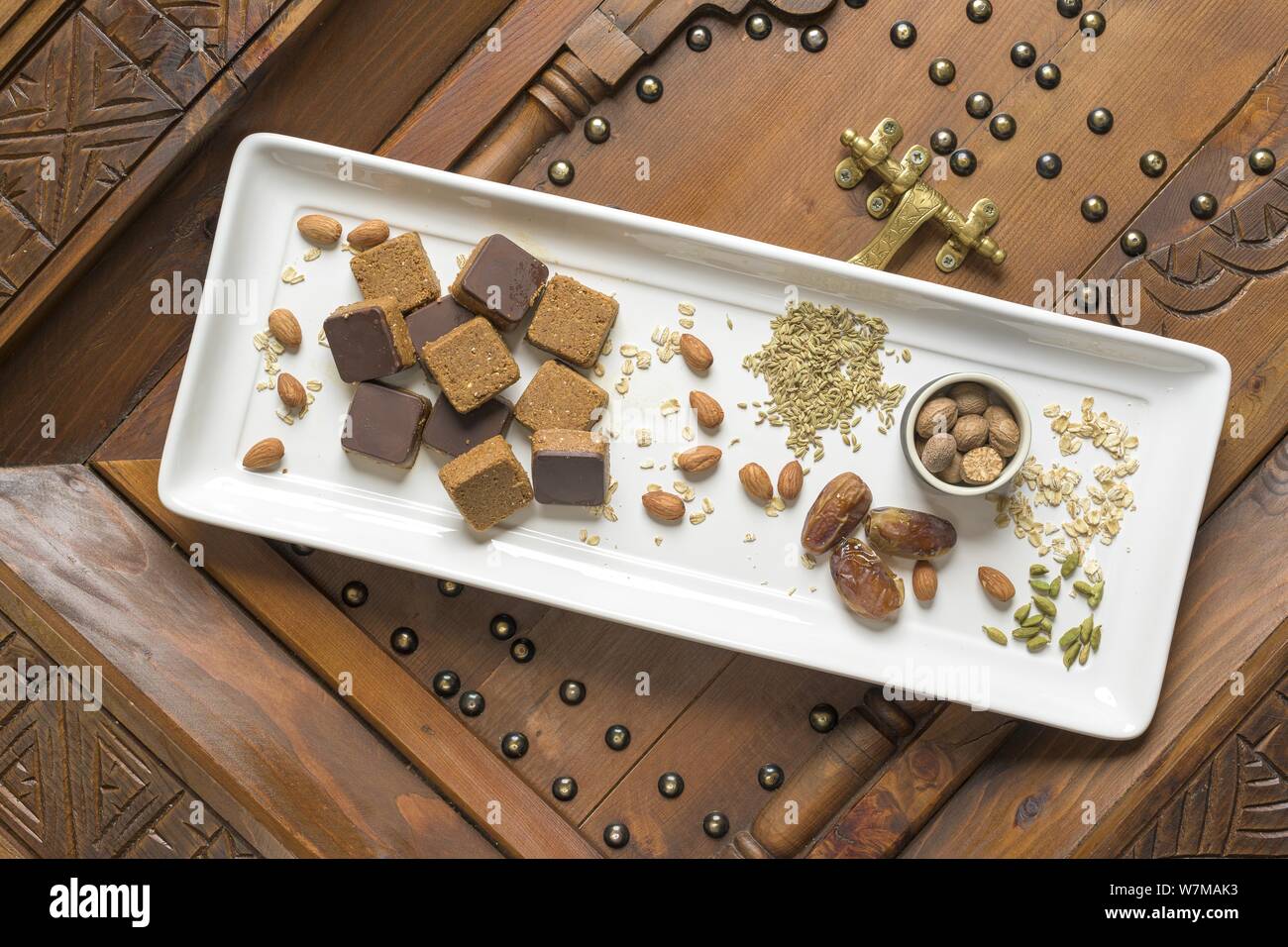 Overhead shot of different types of nuts and square-shaped nuts on a ...
