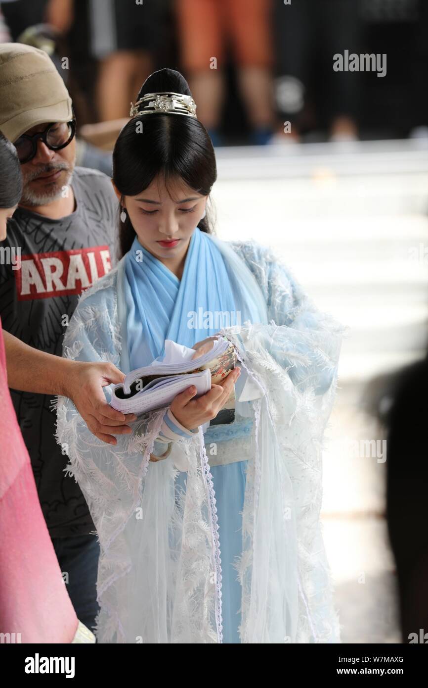 Chinese actress Ju Jingyi, center, of Chinese girl group SNH48 and co ...