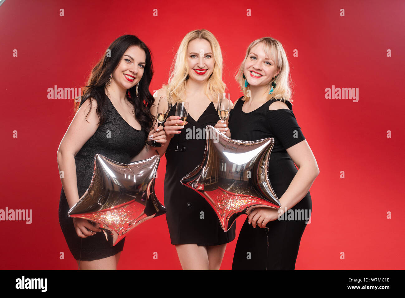 Three beautiful woman celebrating a party and having fun Stock Photo ...