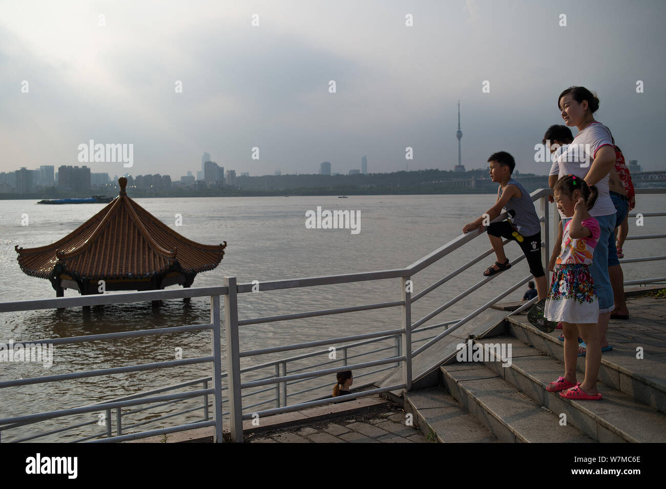 Citizens look at the floodwater from the flooded Yangtze River caused ...