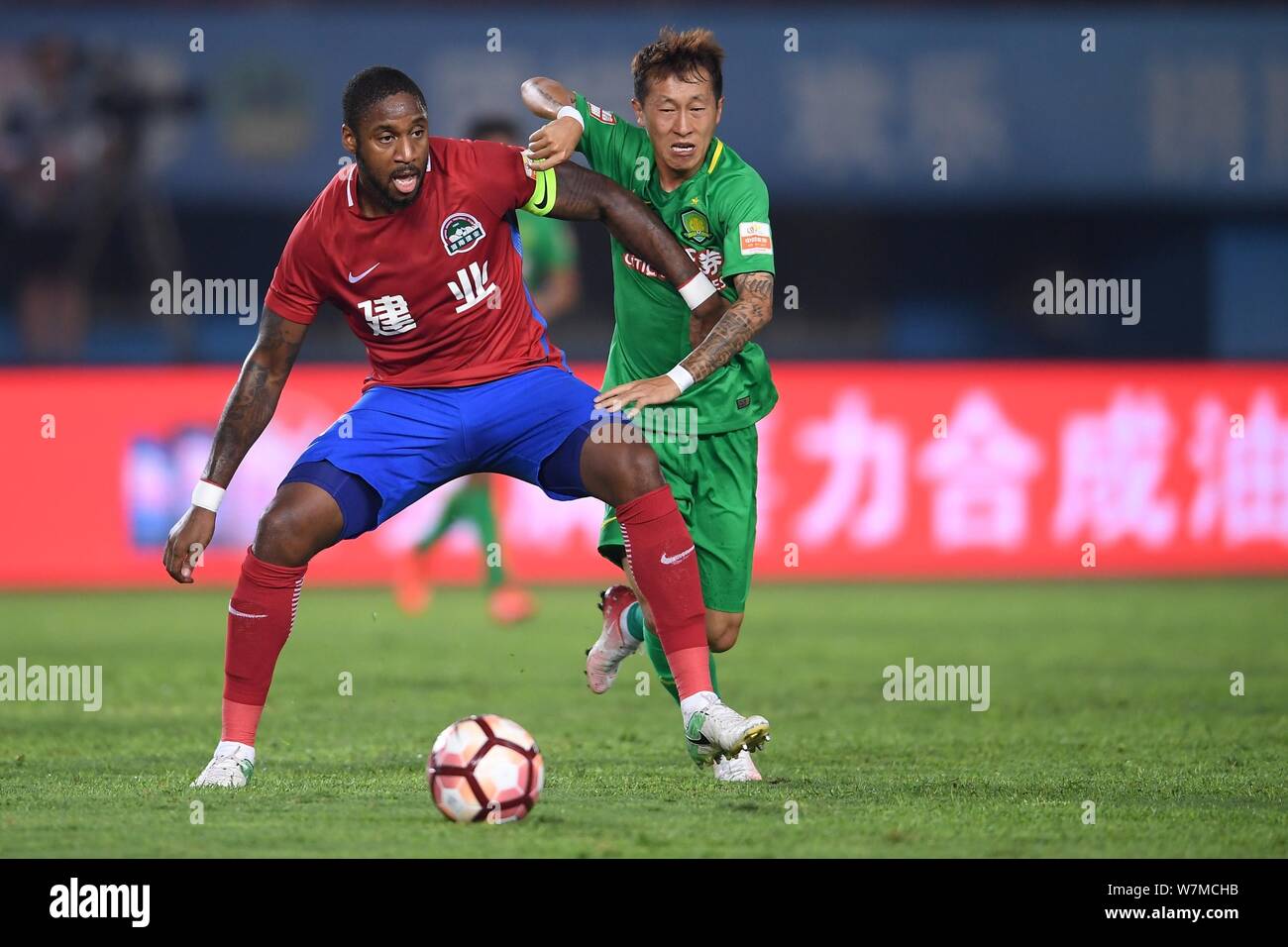 Bissau-Guinean football player Edigeison Gomes, left, of Henan Jianye ...
