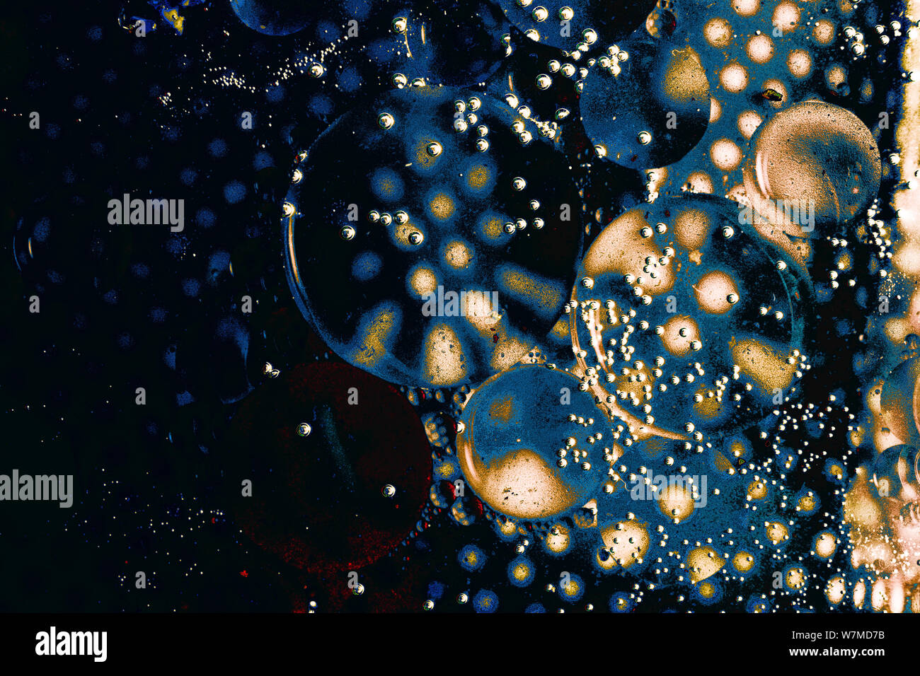 Oil bubbles inside water base form patterns Stock Photo - Alamy