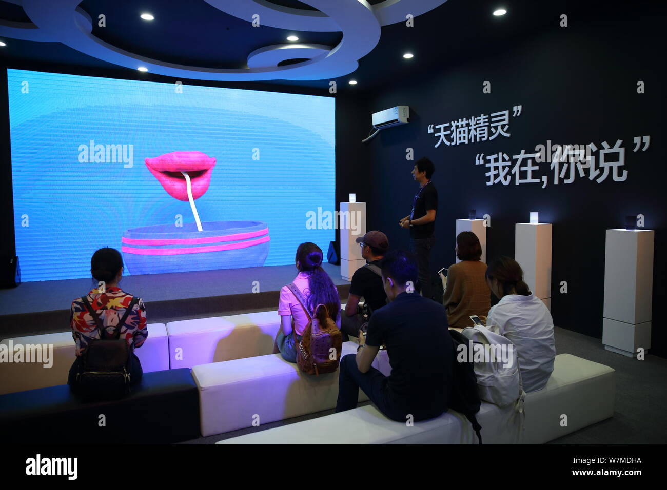 Visitors try out Alibaba Group's "Tmall Genie X1", an Amazon Echo-like ...