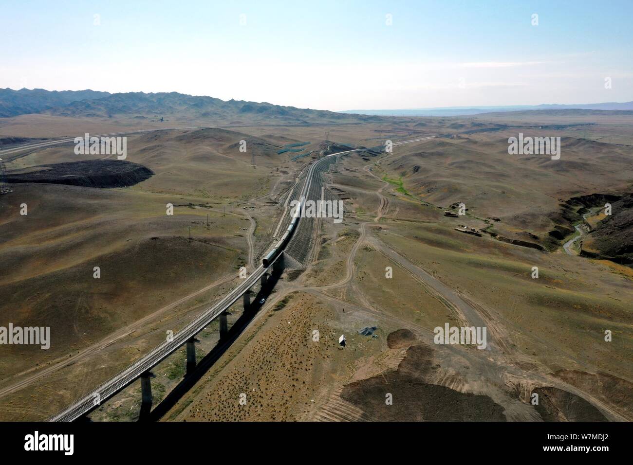 Tacheng, China. 06th Aug, 2019. The train cross wilderness and connect ...