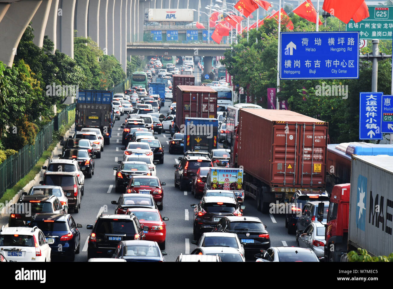 --FILE--Masses of vehicles move slowly on a road in a traffic jam ...