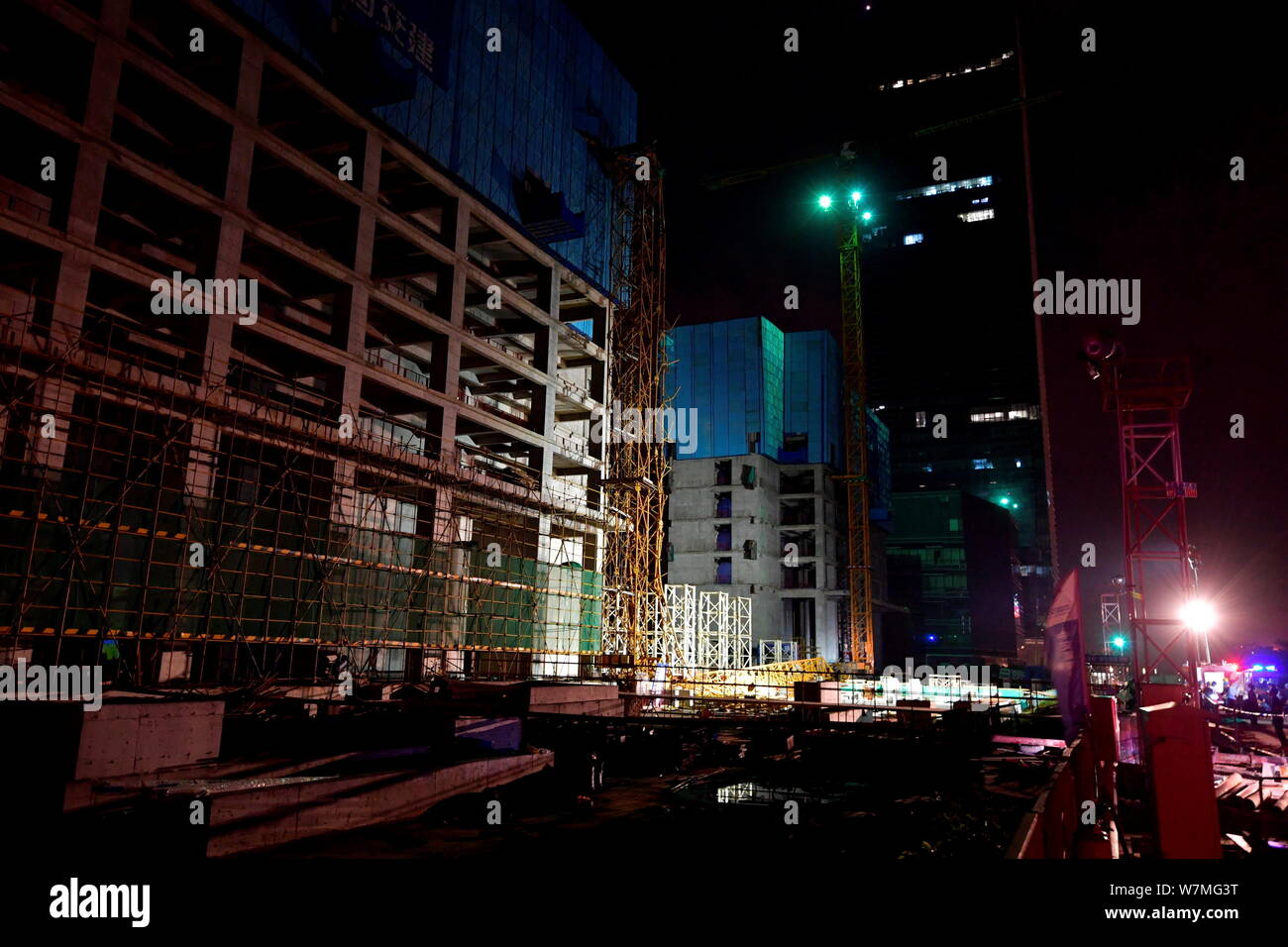 The deformed steel structure of a collapsed tower crane is seen at a ...