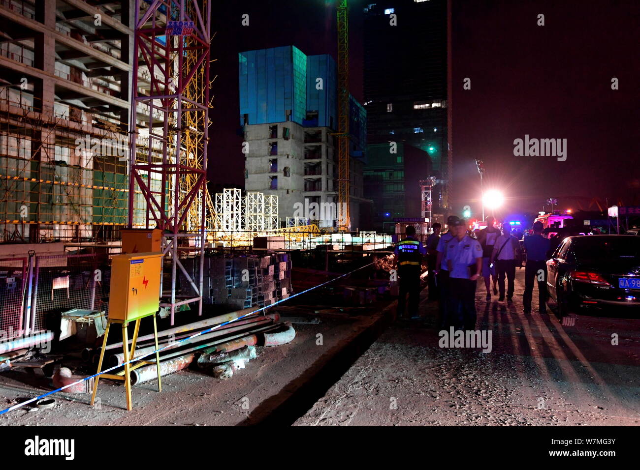 The deformed steel structure of a collapsed tower crane is seen at a ...