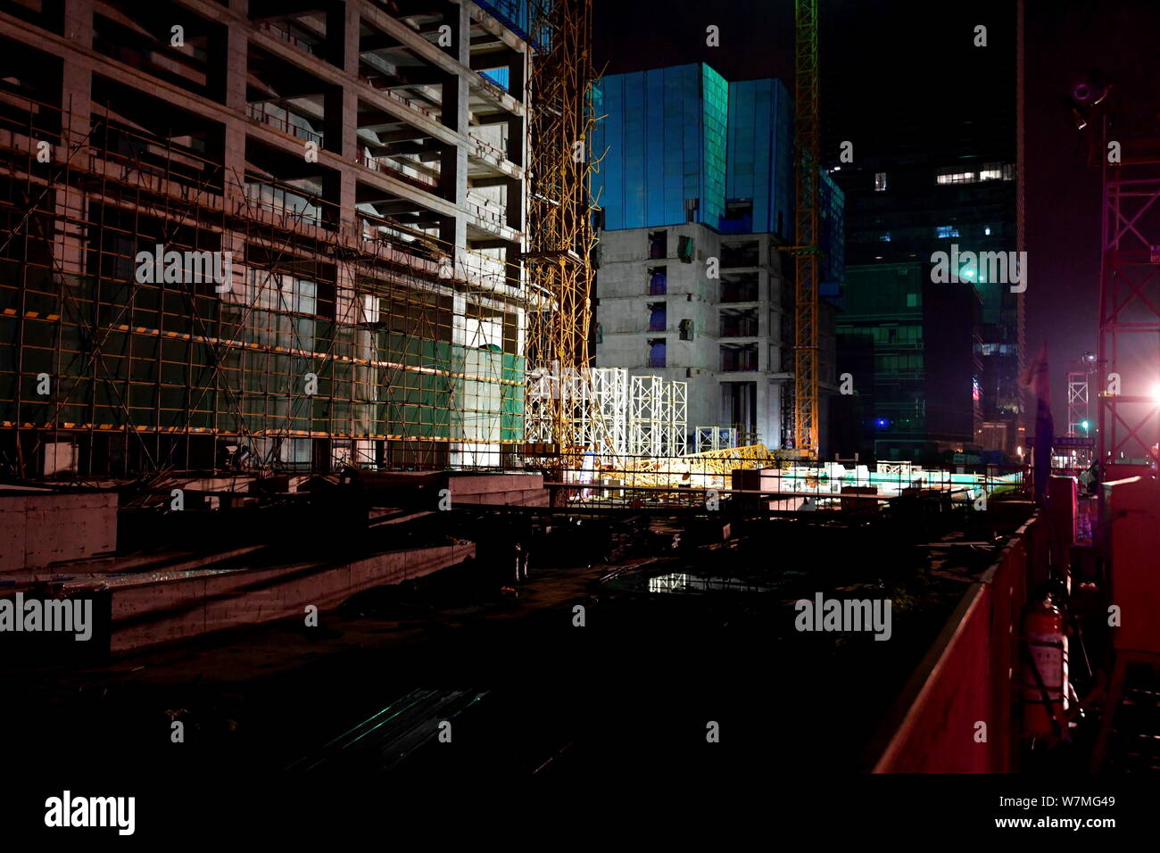 The deformed steel structure of a collapsed tower crane is seen at a ...