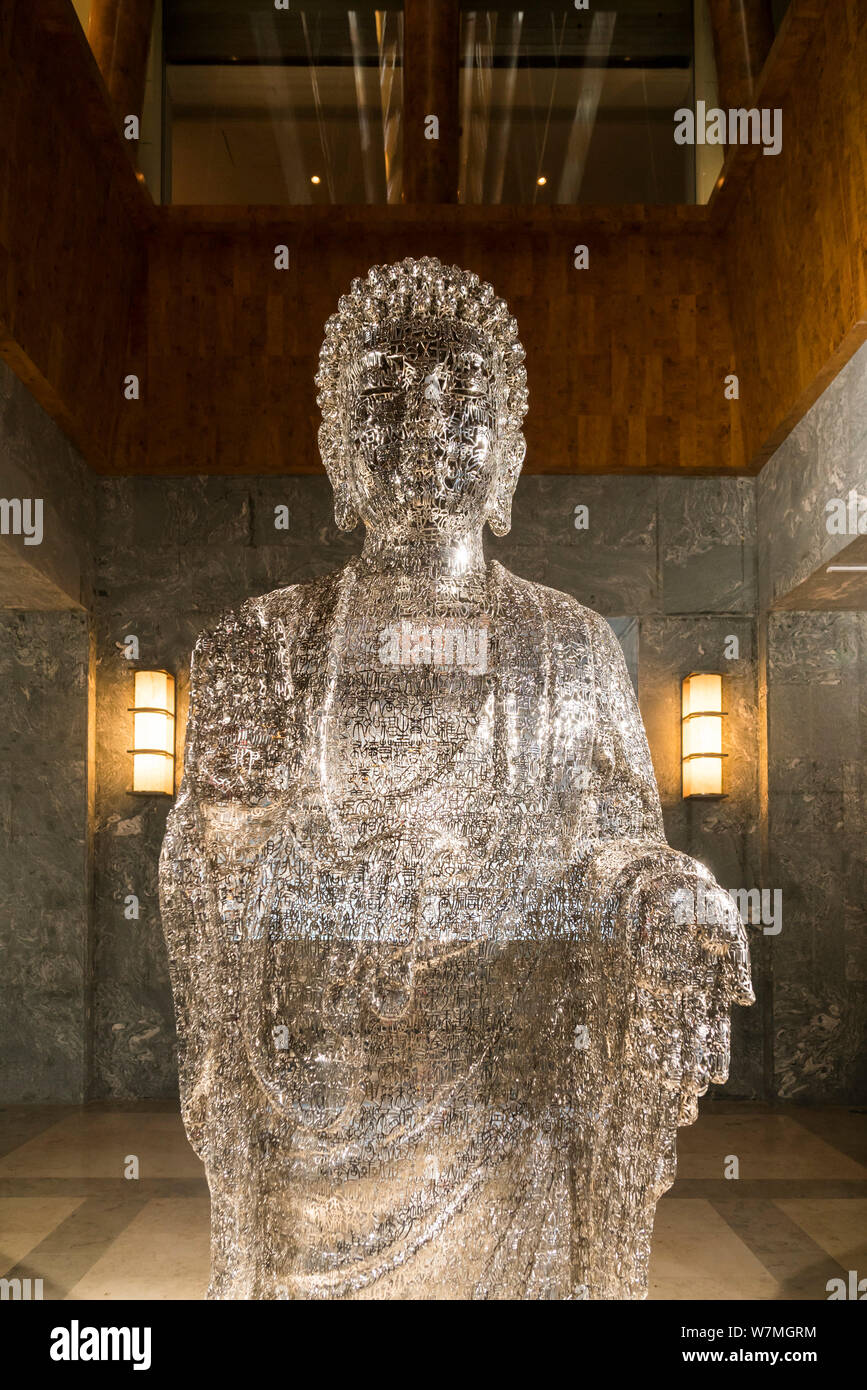 An artwork in the form of a Buddharupa named "Wenyu" is on display at ...