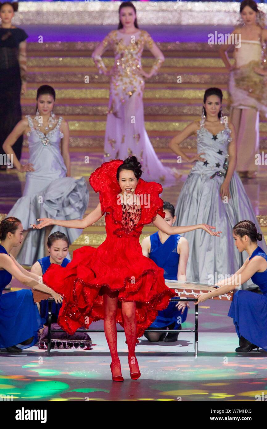 Hong Kong singer Karen Mok, center, performs during a grand variety ...