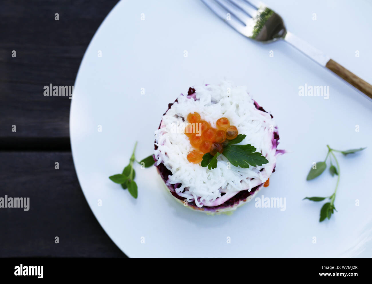 layered salad with beets, fish and potatoes Stock Photo - Alamy