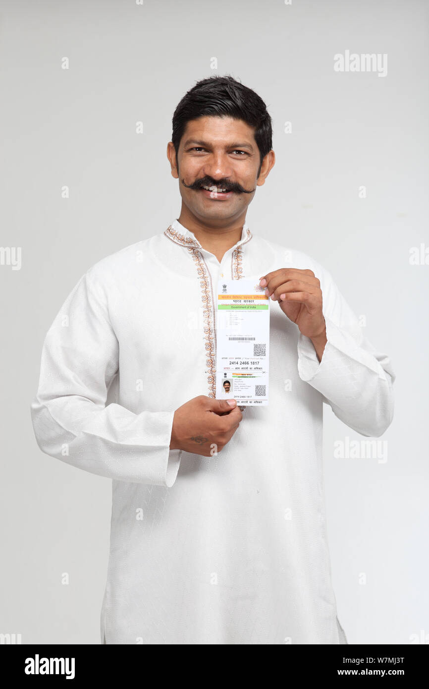 Rural man showing an Aadhar card Stock Photo - Alamy