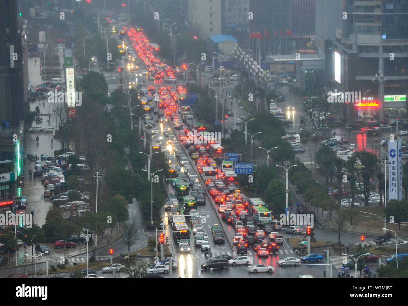 --FILE--Masses of vehicles move slowly on a road in a traffic jam ...